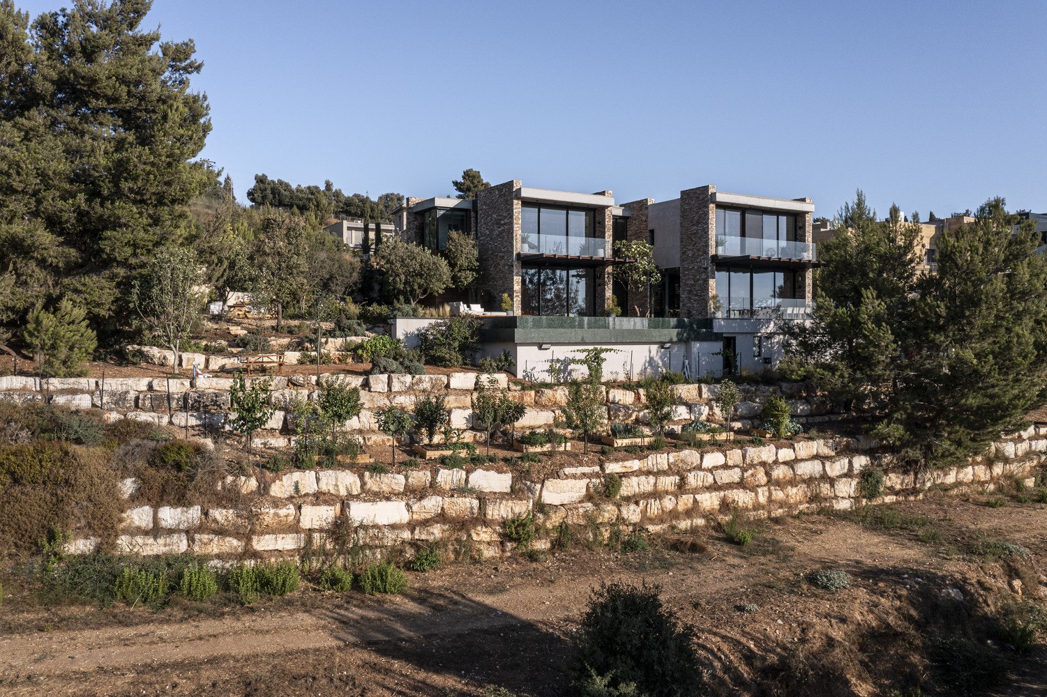 Contemporary Stone Villa by Dana Oberson Architects in Neve Ilan, Israel