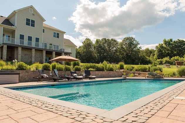 15 Rustic Swimming Pool Designs for a Tranquil Oasis